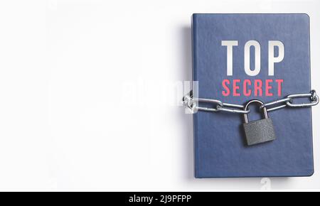 The book is locked under lock and key on a white background. Secret ...