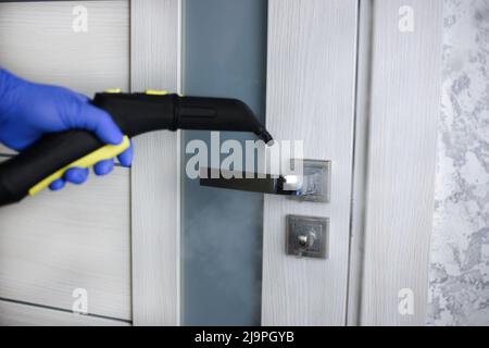 Cleaning and disinfection of the door handle with hot steam ...