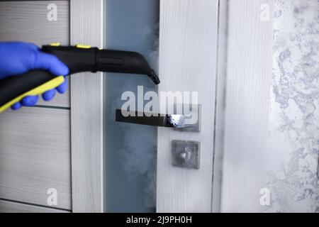 Cleaning and disinfection of the door handle with hot steam ...