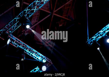 Crowd at concert - Cheering crowd in bright colorful stage lights Stock ...