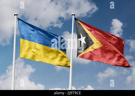 East Timor and Ukraine two flags textile cloth, fabric texture Stock ...