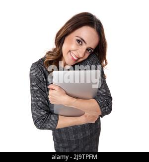 Happy young businesswoman holding her dear laptop, isolated on white ...