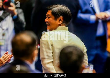 Philippine President Rodrigo R. Duterte smiles as he views two custom ...