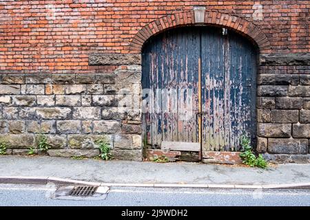 Entrance to old factory or workshop UK Stock Photo - Alamy