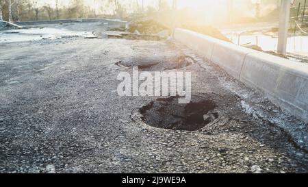 Asphalt swelling close-up. Pothole and pit on road Stock Photo - Alamy