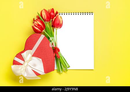 Yellow tulips notepad and gift box Stock Photo - Alamy