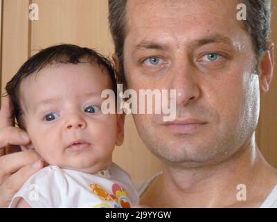 newborn baby and his excited, puzzled father Stock Photo - Alamy