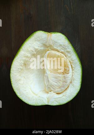 Pomelo green fruit closeup skin texture on white Stock Photo - Alamy