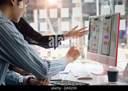 Professionals web developers team working together for mobile ...