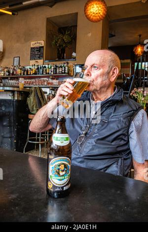 Berlin Prenzlauer Berg. Haliflor Bar & cafe interior. Elderly man ...