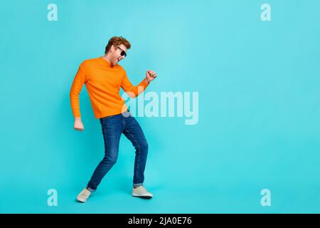 Photo of pretty funky guy dressed striped shirt having fun pointing ...