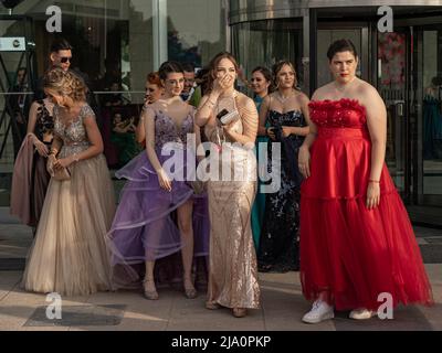 Gorgeous young people school leavers dressed in elegant ballgown and ...