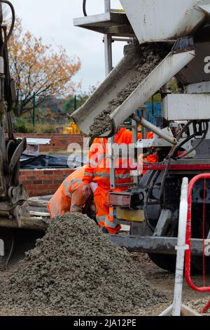 Ready-mix semi-dry concrete delivered on construction site by concrete ...