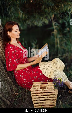 Outdoor spa lifestyle concept with woman using digital hot tub controls ...