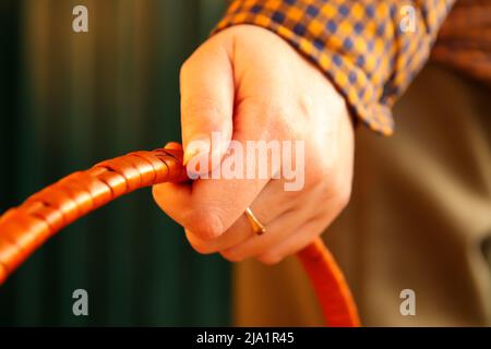 Defocus female hand holding while of a orange fruit. Healthy food ...