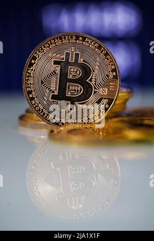 Gold Bitcoins with candle stick graph chart and digital background ...