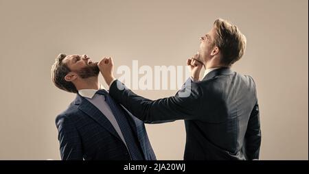 fighting businesspeople. dissatisfied men. fist in face. colleagues ...