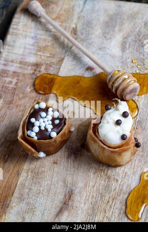 sweets made of thin puff pastry with chocolate filling and honey ...