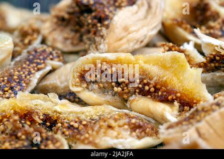 ripe dried figs with seeds during dessert preparation, sliced figs with ...
