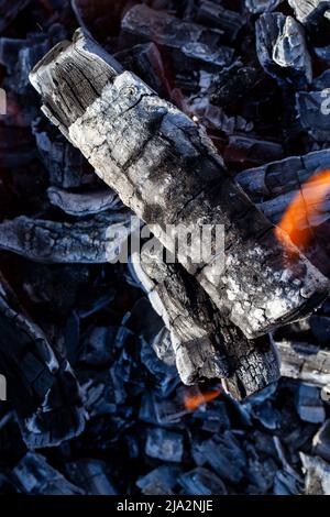 A fire made of logs while cooking barbecue on vacation at the weekend ...