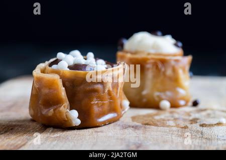 sweets made of thin puff pastry with chocolate filling and honey ...