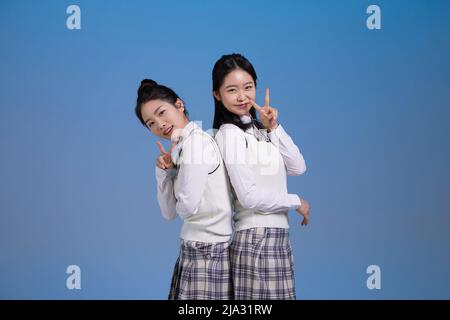 cute Korean Asian girls with v finger cheese pose Stock Photo - Alamy