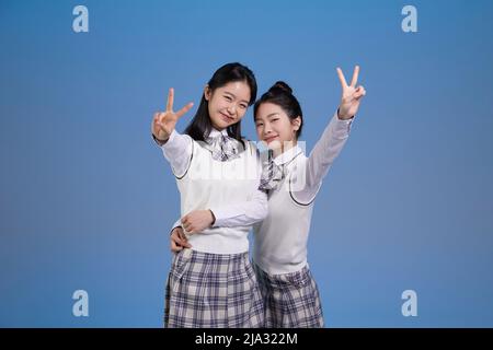 cute Korean Asian girls with v finger cheese pose Stock Photo - Alamy