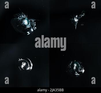 stone chip in a car windscreen isolated on black background, cracked ...