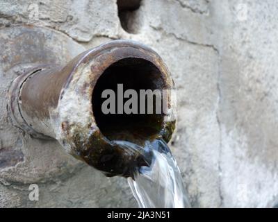 Natural Water Source from metal pipe Stock Photo - Alamy