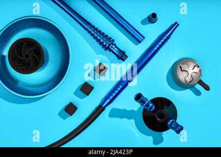 Parts of blue decorated hookah or shisha on light blue backgroun Stock ...