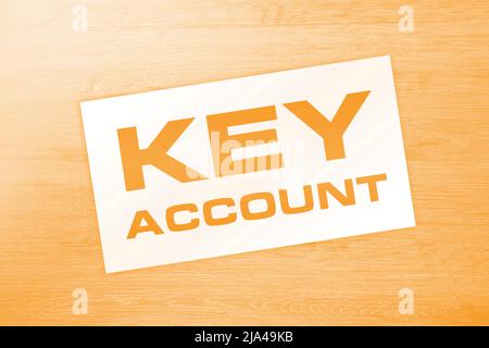 blank card with text KEY ACCOUNT on wooden background. Business concept ...