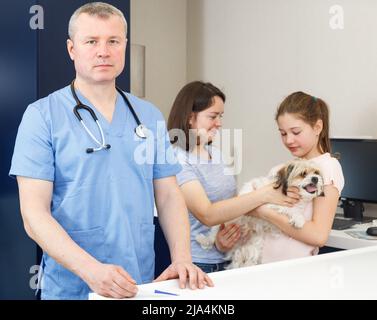 Confident male veterinarian in vet office Stock Photo - Alamy