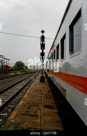 Passanger train stopped at station in Java Island, Indonesia Stock ...