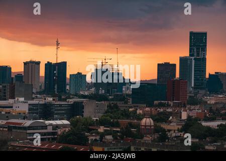 A dramatic and fiery sunset over the skyline of Mexico City, Mexico ...