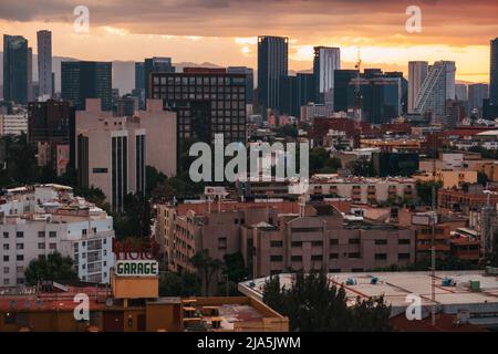 A dramatic and fiery sunset over the skyline of Mexico City, Mexico ...