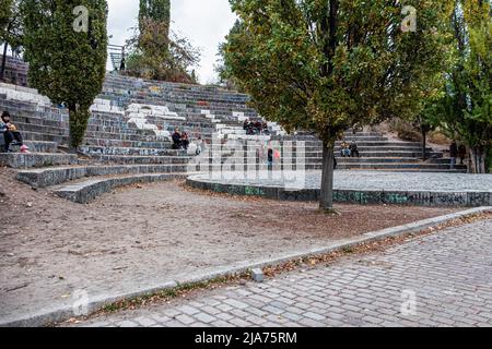 Few people sit at the karaoke stage and basketball court in Mauerpark ...