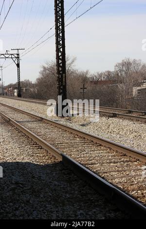 Typical common railroad tracks crossing the plains on a bright sunny ...