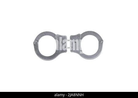 Metal handcuffs. Bracelets for shackling detained criminals. Isolate on ...