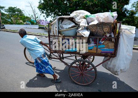 Asian Old man collecting garbage with tri cycle Stock Photo - Alamy