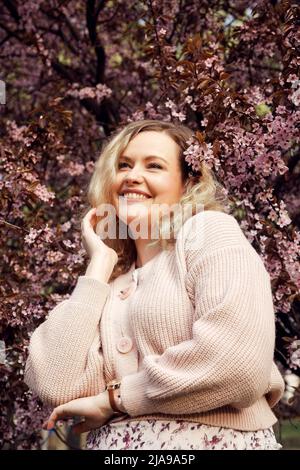 Beautiful branch of lilac in green leaves. Selective focus. Closeup ...