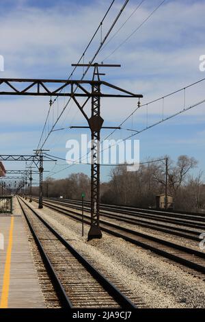 Power lines marching along the typical railroad tracks Stock Photo - Alamy