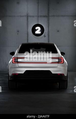 a Snow white Polestar 2 tailgate in a garage Stock Photo - Alamy