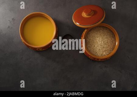 Homemade ghee in a ceramic pot and a sticker with the inscription with ...