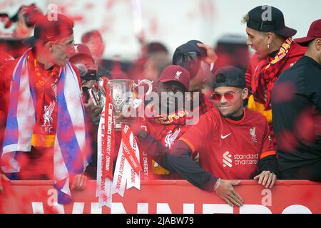 Liverpool's Sadio Mane lifts the trophy with his team-mates after the ...