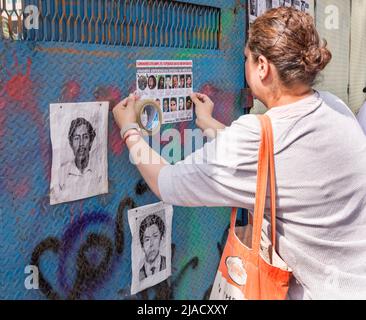Pasting Poster on Wall Stock Photo - Alamy