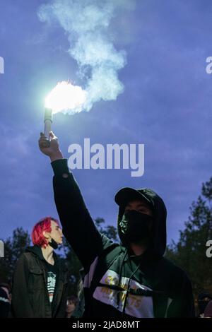 Protestor hold a bomb smoke during a protest in Paris Stock Photo - Alamy