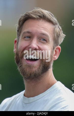 Scottish DJ Calvin Harris performing for the Liverpool FC open top bus ...