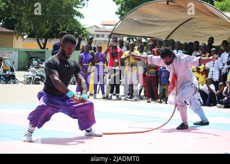 Cotonou, Benin. 29th May, 2022. Children perform martial arts during a ...