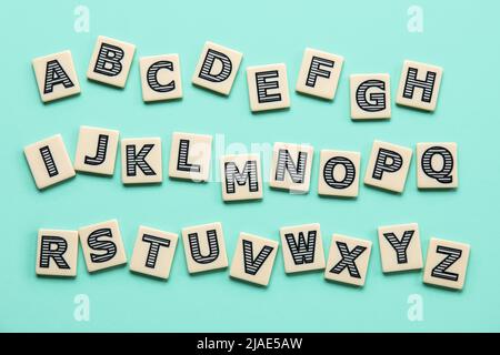 Different letters on blue background. Alphabet concept Stock Photo - Alamy