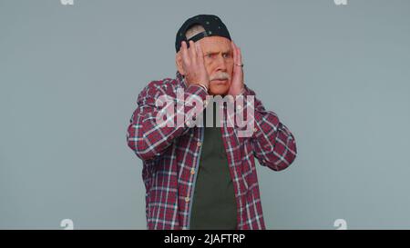 Scared fearful depressed man expresses his fear and waves his hands ...